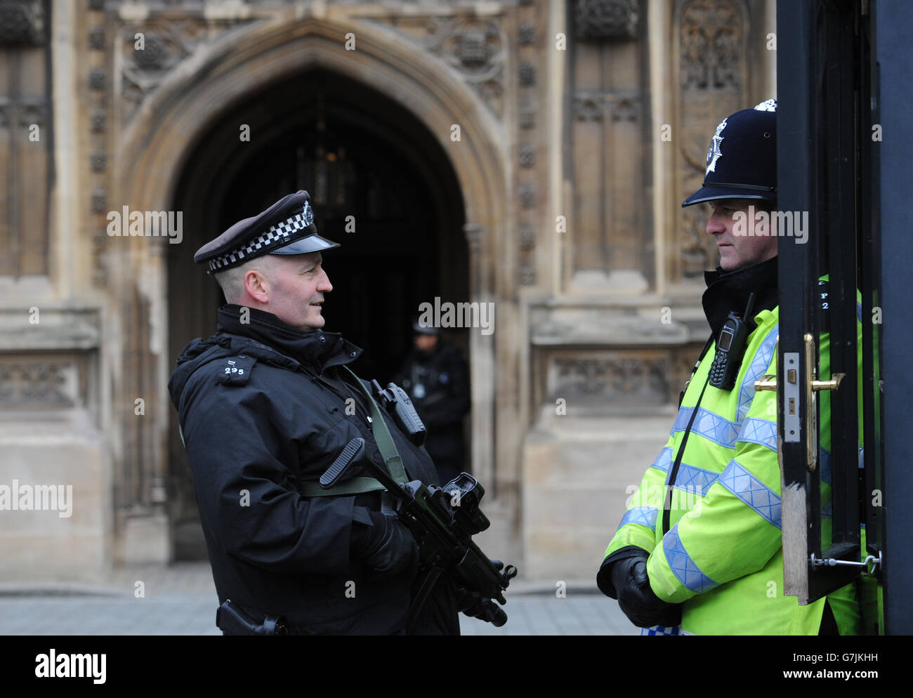 Armed police officers outside the Houses of Parliament in London, as ...