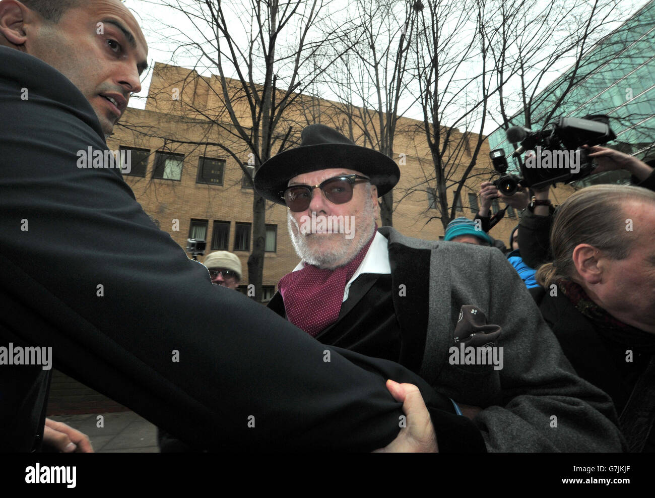 Former pop star Gary Glitter (centre), whose real name is Paul Gadd ...