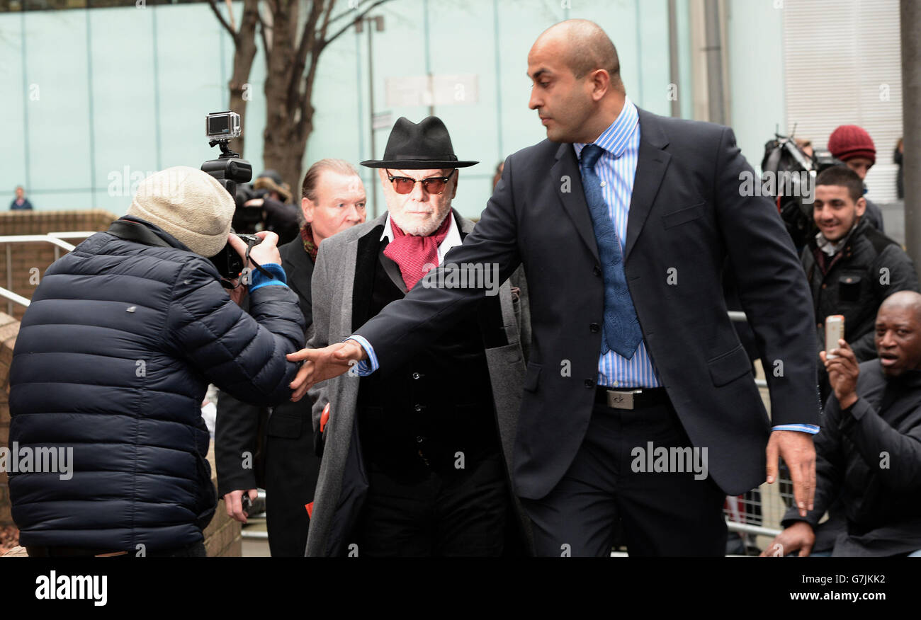 Former pop star Gary Glitter (centre), whose real name is Paul Gadd ...