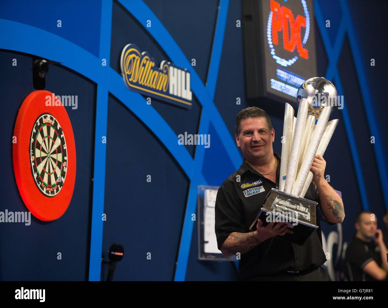 Gary Anderson celebrates with the Sid Waddell trophy after defeating ...