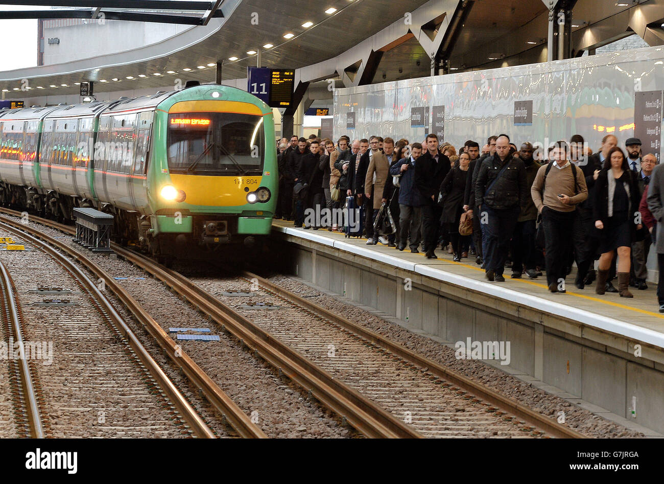 Commuters use the new Platform 11 at London Bridge train station in ...