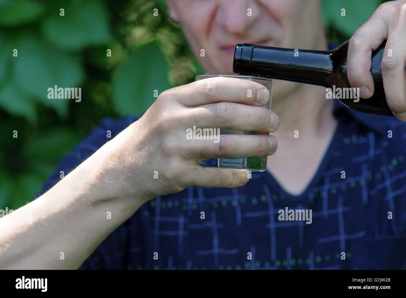 Alcohol addiction man pouring hi-res stock photography and images - Alamy