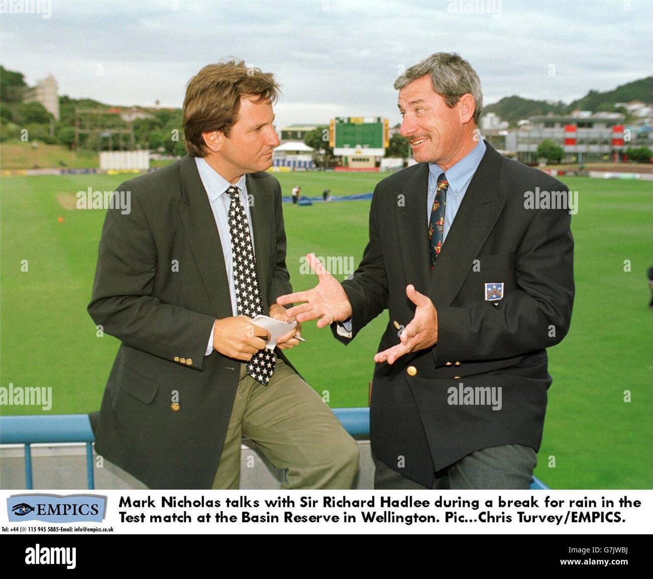 Mark Nicholas talks with Sir Richard Hadlee during a break for rain in ...