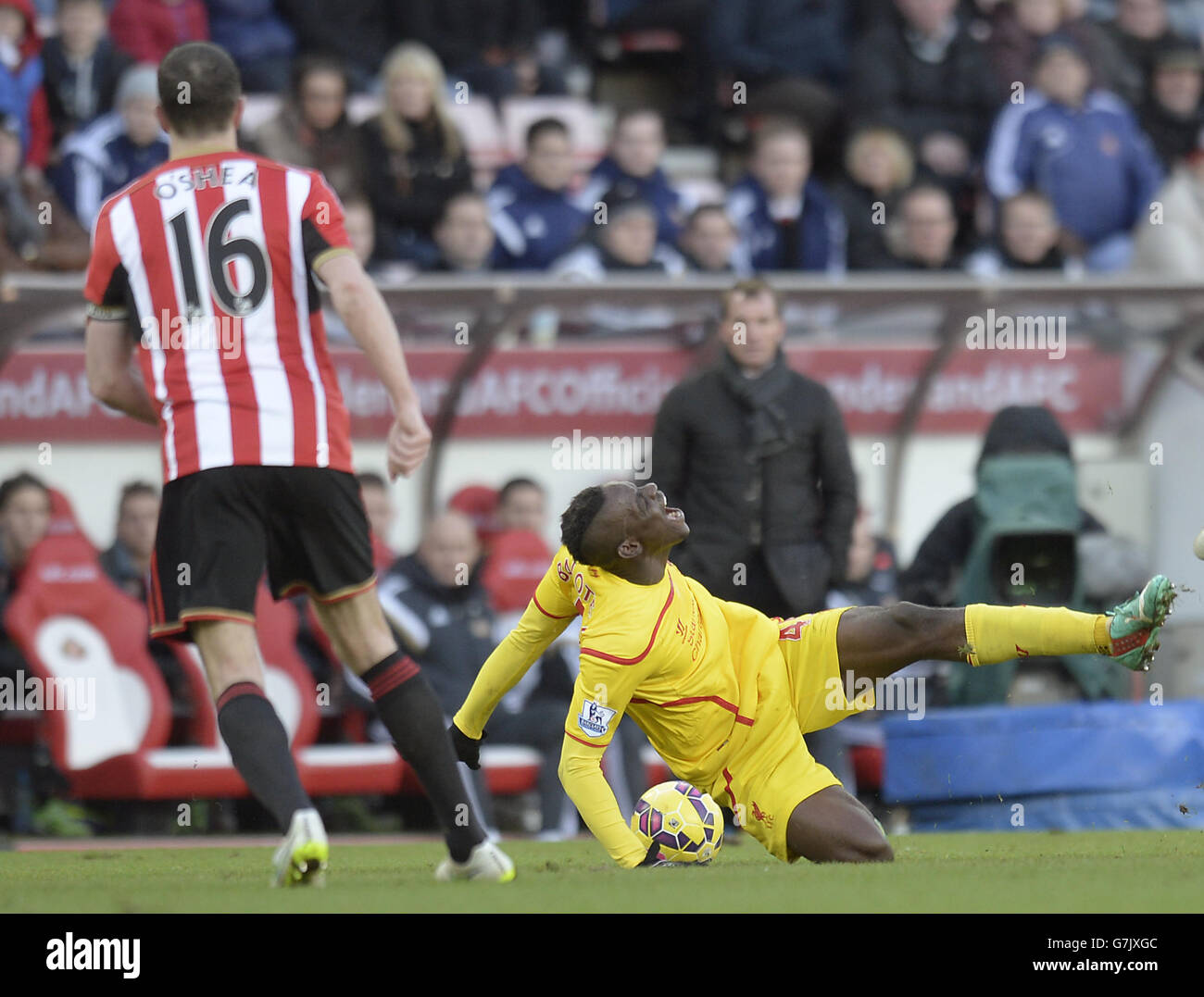 Liverpool's Mario Balotelli (right) goes to ground during the Barclays ...