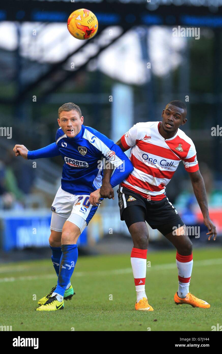 Doncaster Rovers Reece Wabara and Oldham's Brian Wilson (left) battle ...