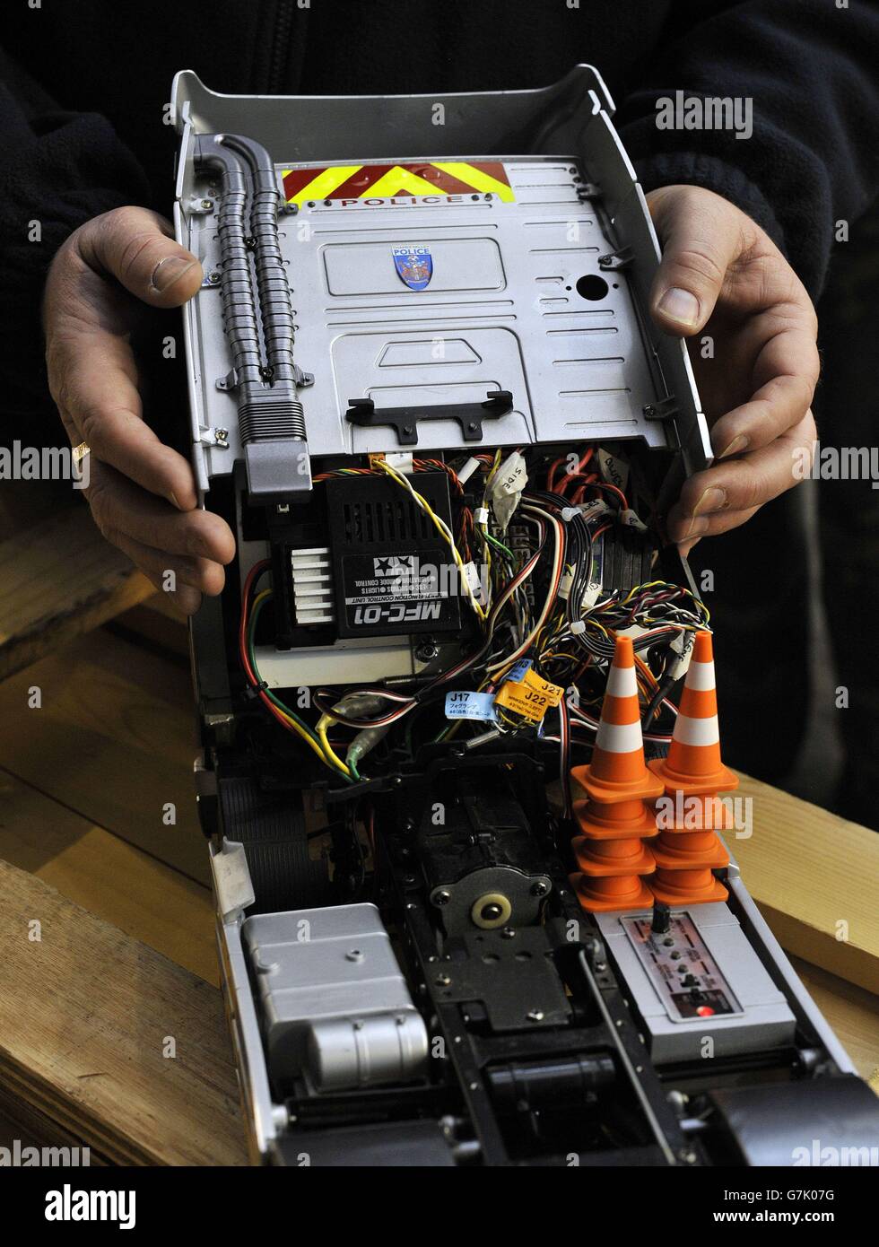 A modeller opens the cab of his remote control truck during the preview ...