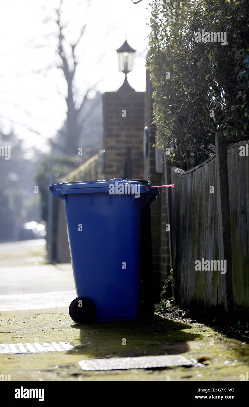 Rubbish stock. Rubbish (black) and recycling bins line a street in ...