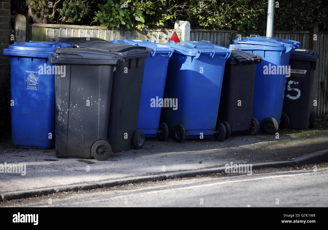 Rubbish stock. Rubbish (black) and recycling bins line a street in ...