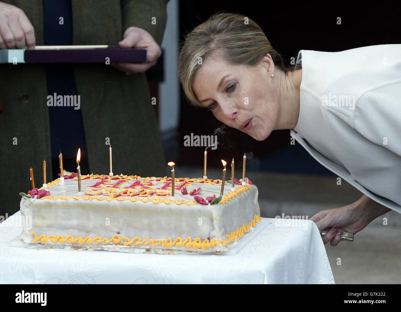 The Countess of Wessex blows out candles on a birthday cake as she ...