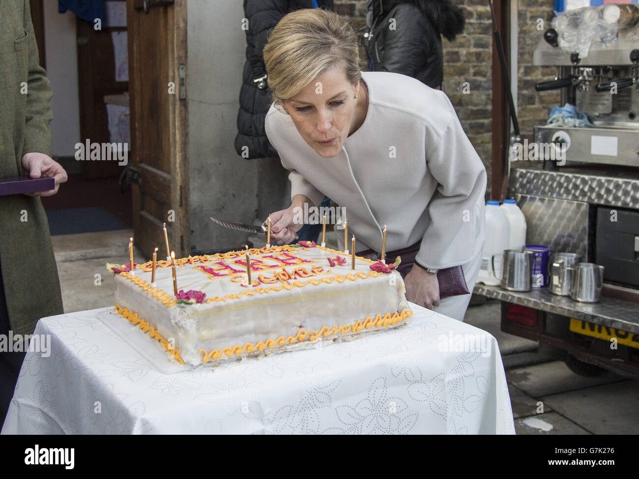 The Countess of Wessex blows out candles on a birthday cake as she ...