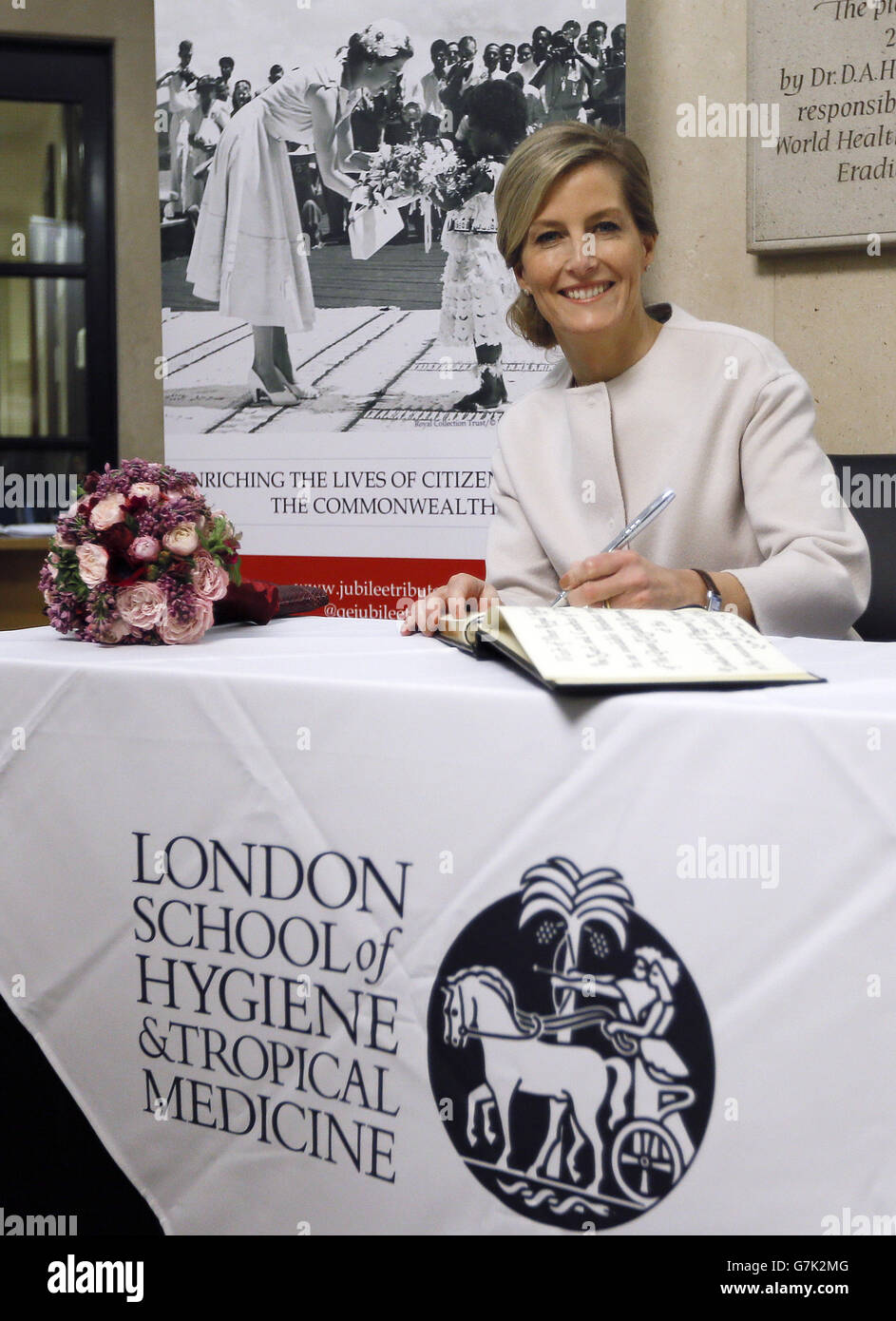 The Countess of Wessex signs the visitors book during a visit to the ...