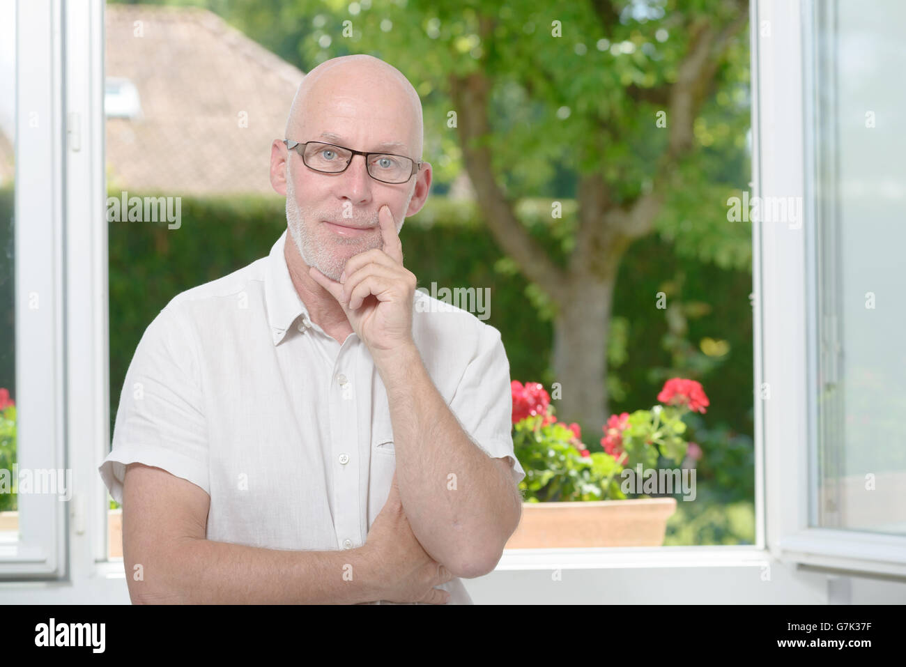 a portrait of a middle-aged man in home Stock Photo - Alamy