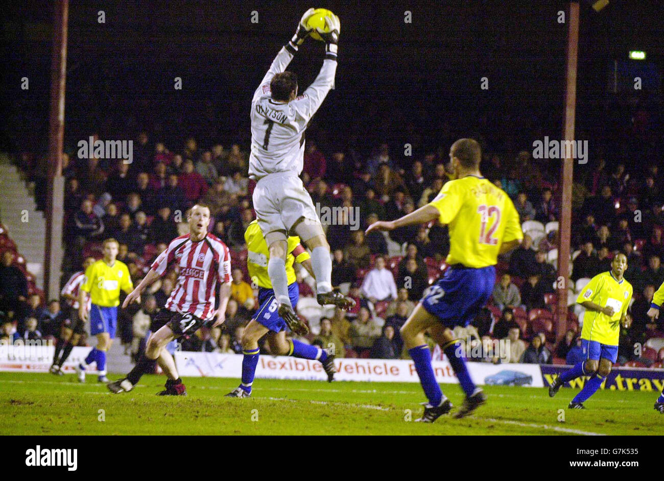 Colchester's Goal keeper Stuart Nelson makes the save Stock Photo - Alamy