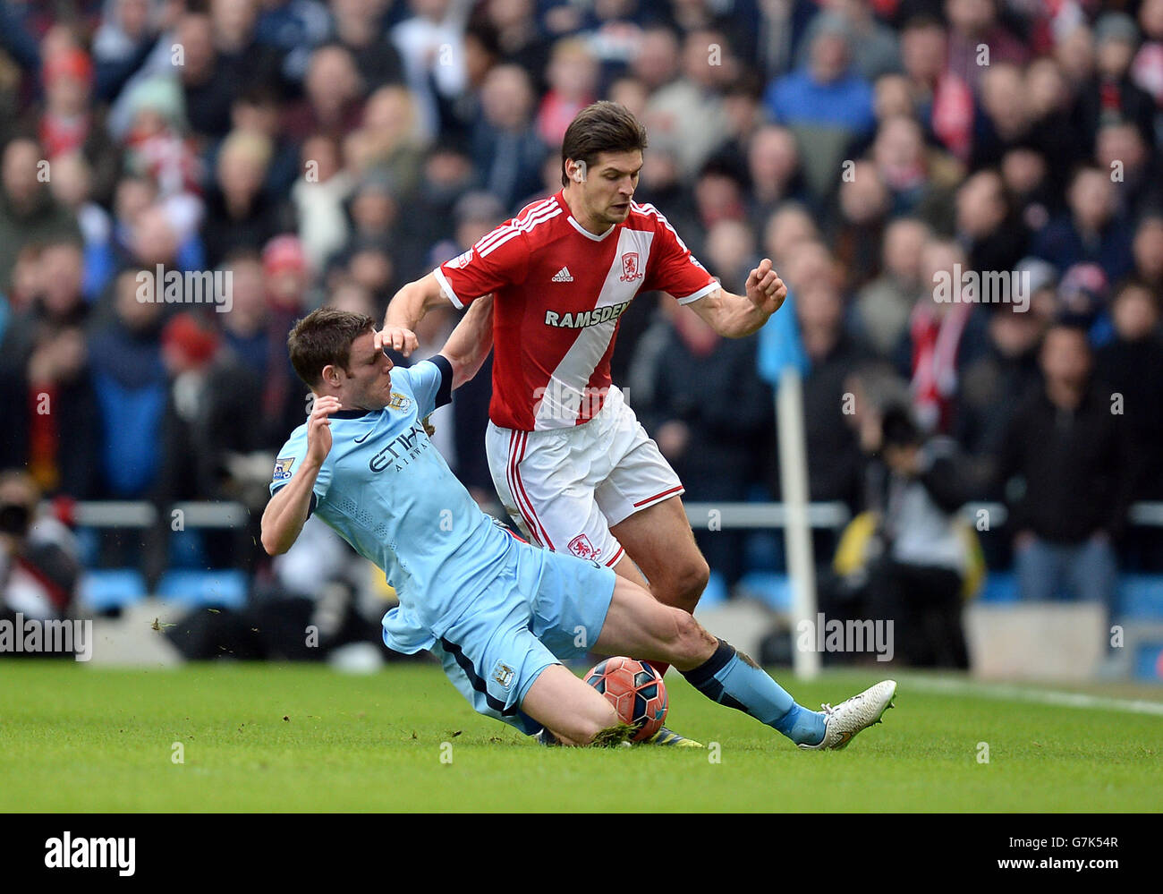 Manchester City's James Milner (left) and Middlesbrough's George Friend ...