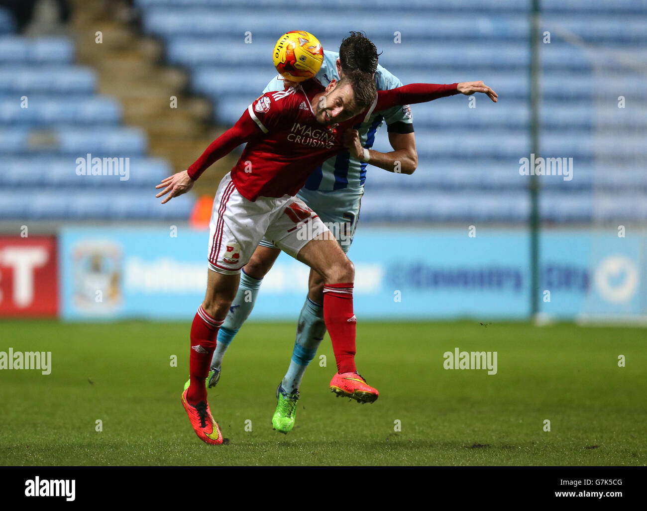 Coventry City's Aaron Martin (right) and Swindon Town's Andy Williams ...