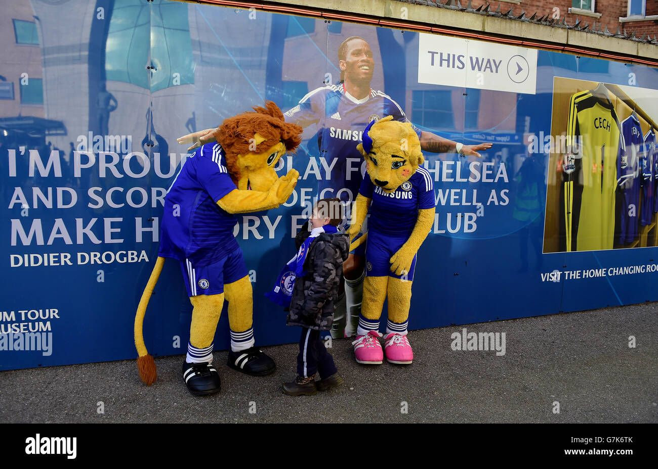 A young Chelsea fan with Stamford The Lion and Bridget The Lioness ...
