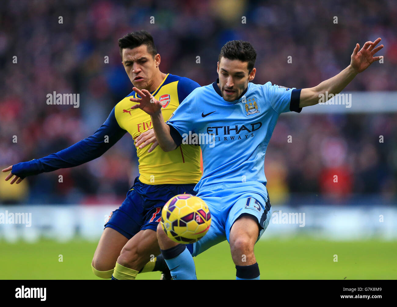 Arsenal's Alexis Sanchez and Manchester City's Jesus Navas battle for ...