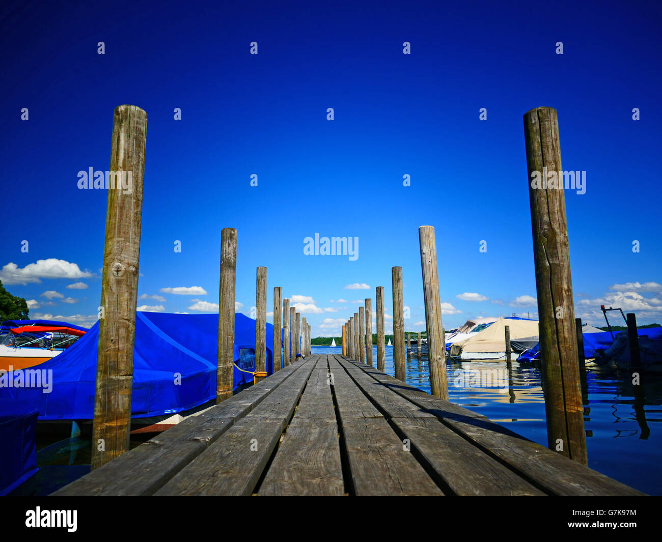 Europe Germany Chiemgau Chiemsee lake Prien wooden bridge boat mooring ...