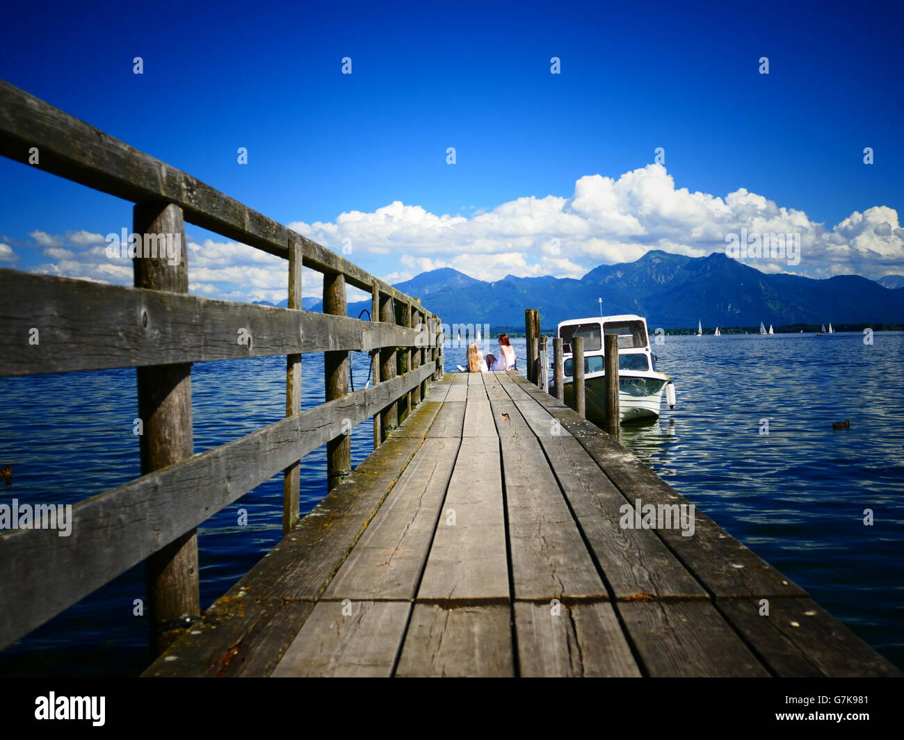 Europe Germany Chiemgau Chiemsee lake Prien wooden bridge boat mooring ...