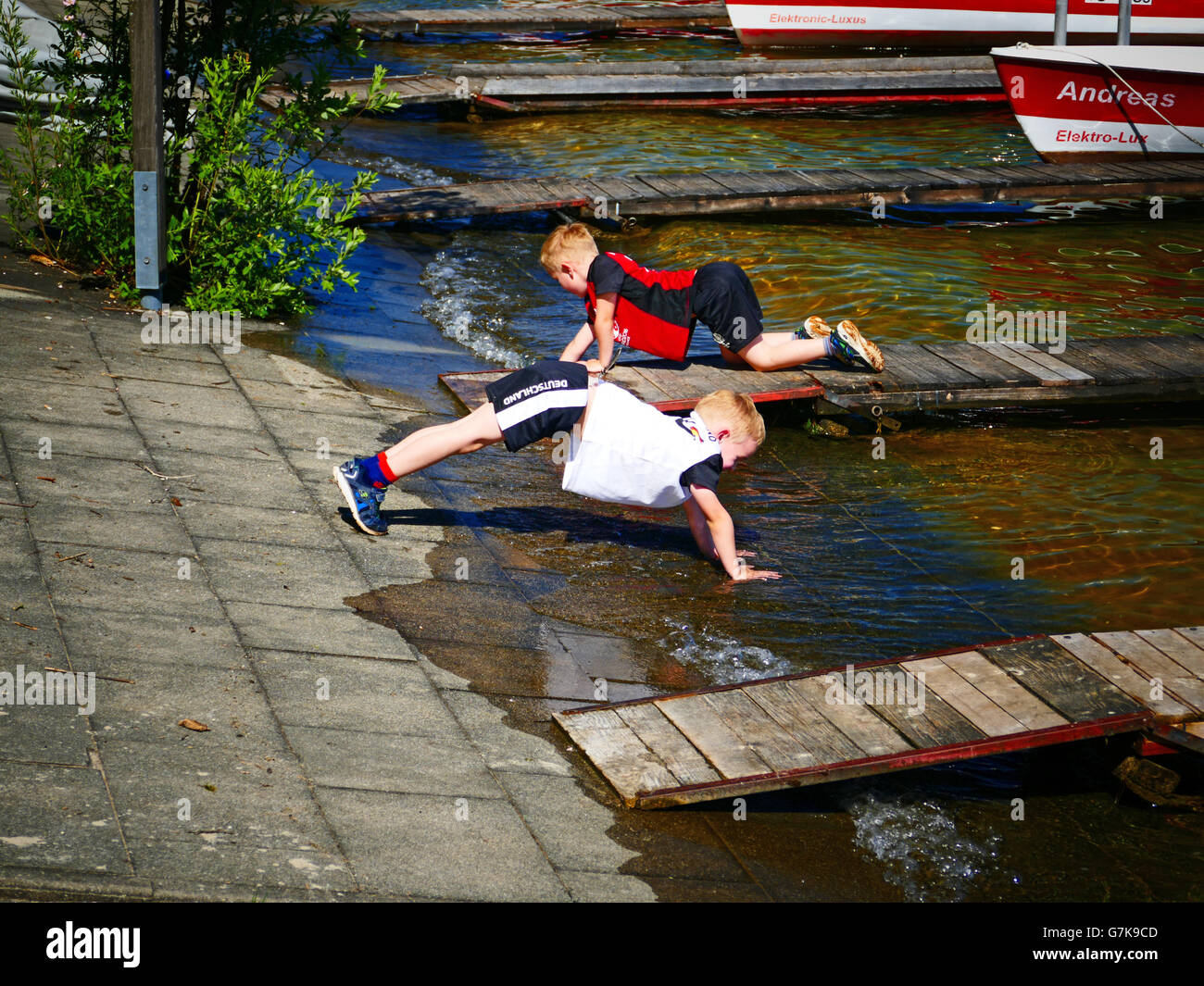 Europe Germany Chiemgau Chiemsee lake Prien wooden bridge boat mooring ...