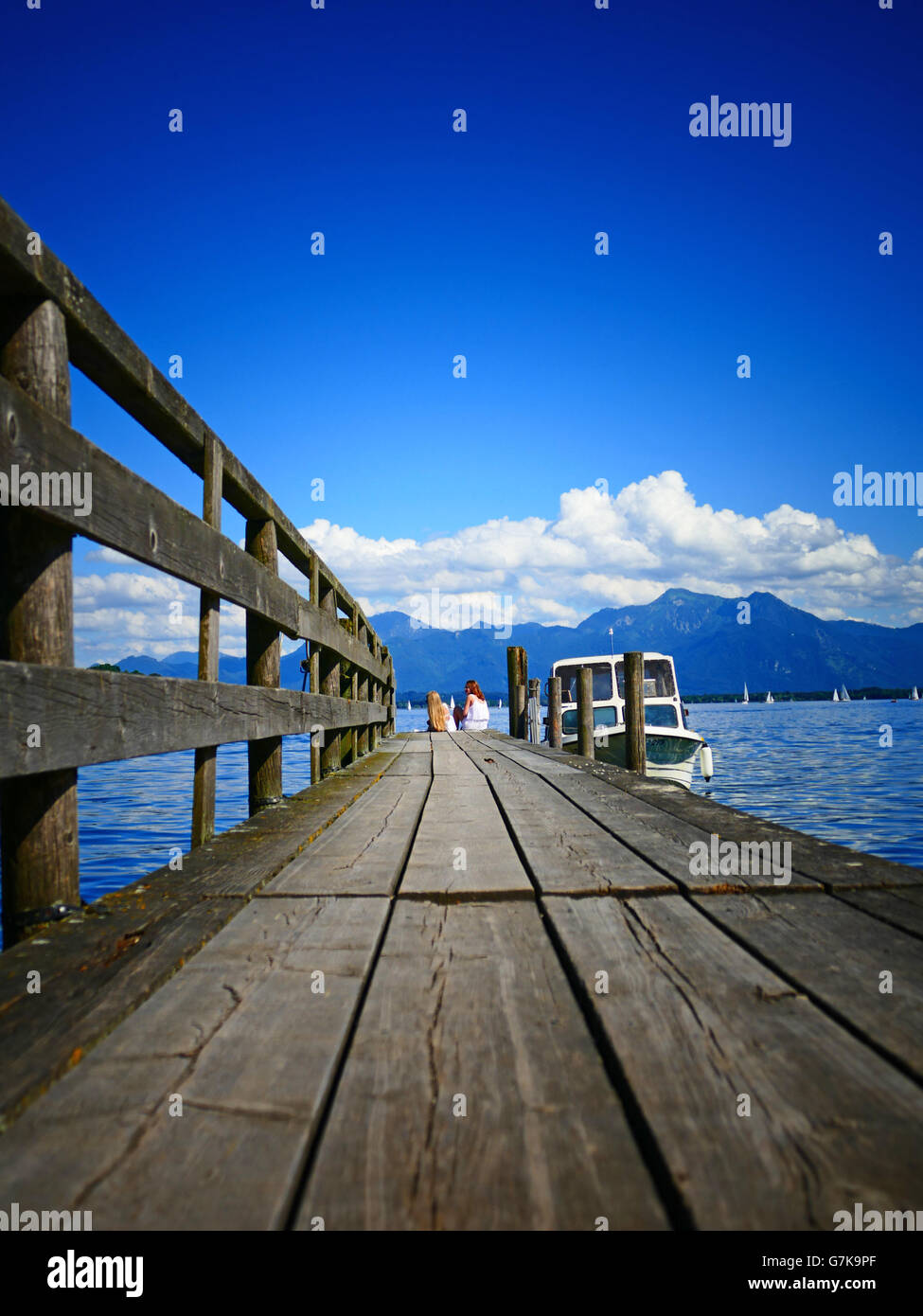 Europe Germany Chiemgau Chiemsee lake Prien wooden bridge boat mooring ...