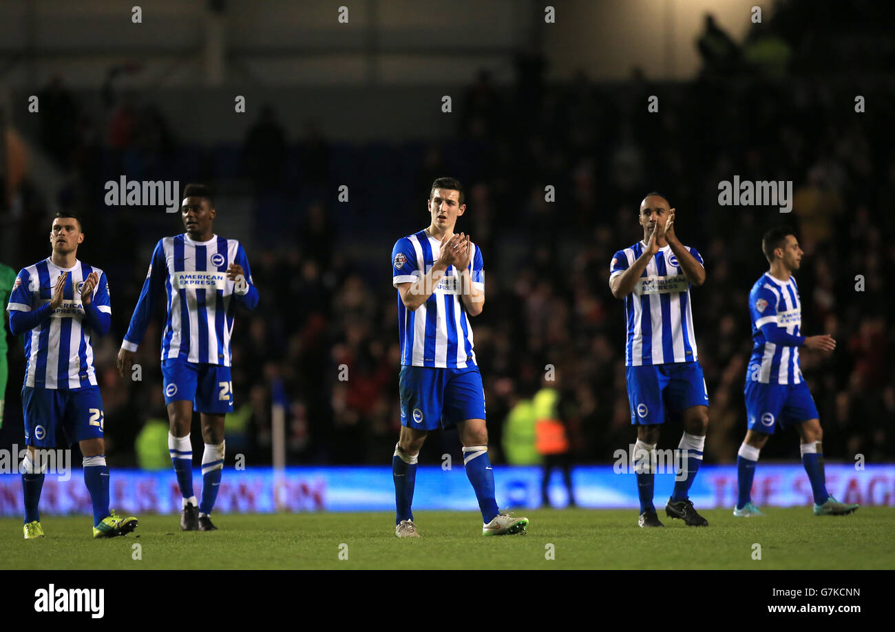 Brighton and Hove Albion's Lewis Dunk and team-mates applaud the fans ...