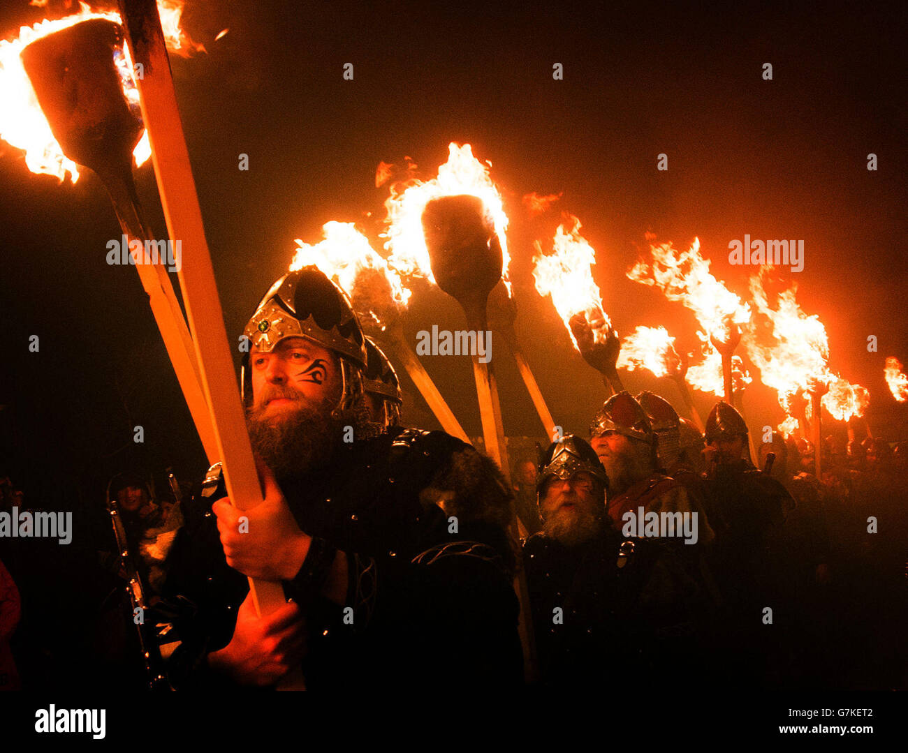Members of the Jarl Squad dressed in Viking costumes, hold flaming ...