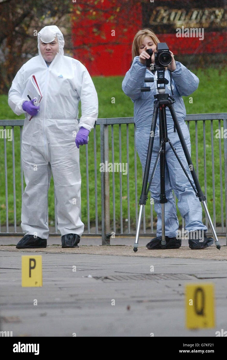 A police forensics team record evidence at the scene of a stabbing ...