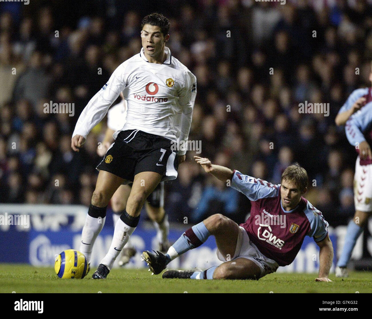 Manchester United's Cristiano Ronaldo (L) skips over the tackle from ...