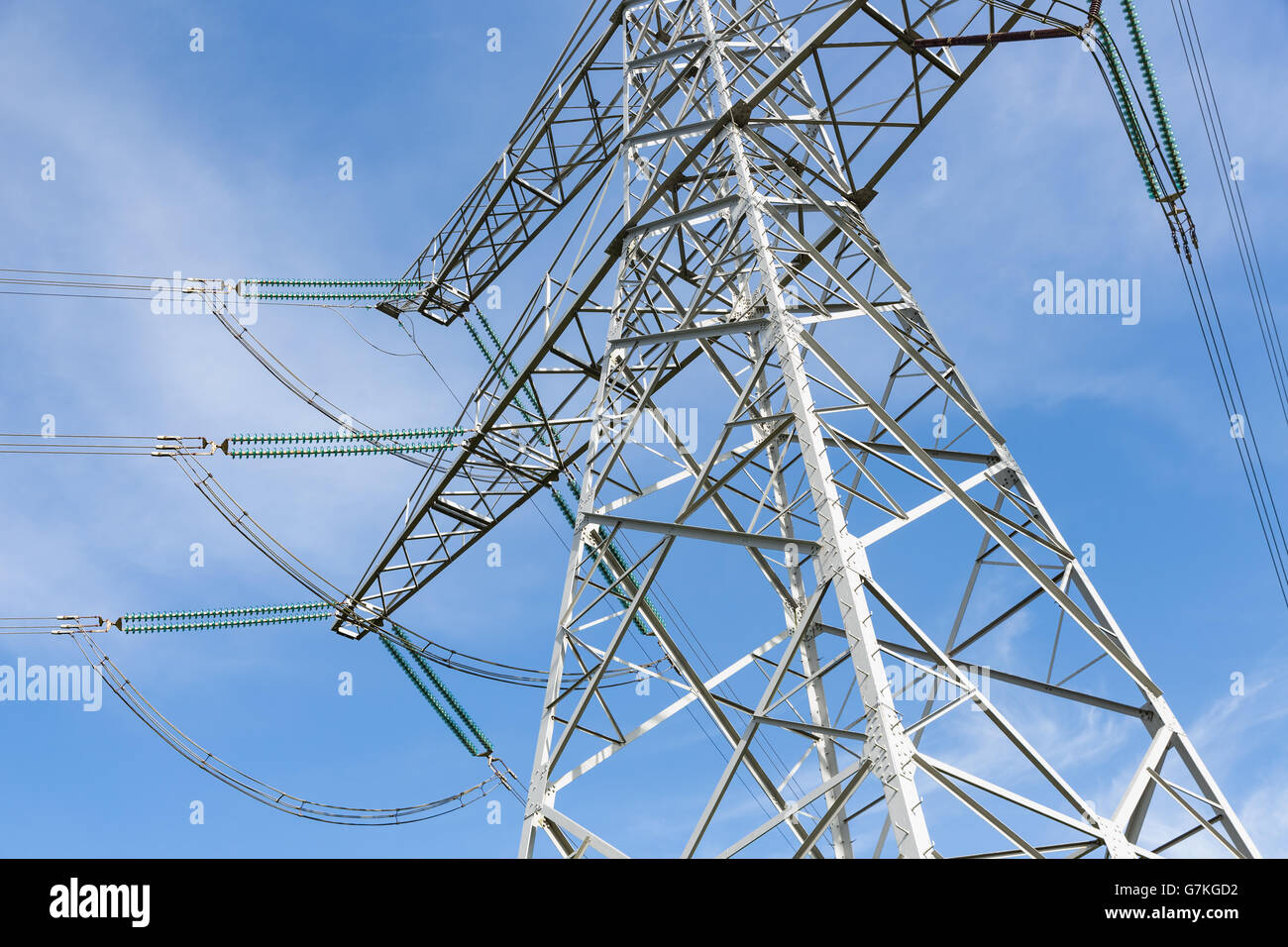 Electricity pylon against a blue sky background Stock Photo - Alamy