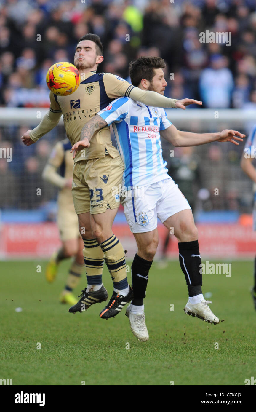 Leeds United's Lewis Cook (left) and Huddersfield Town's Jacob ...