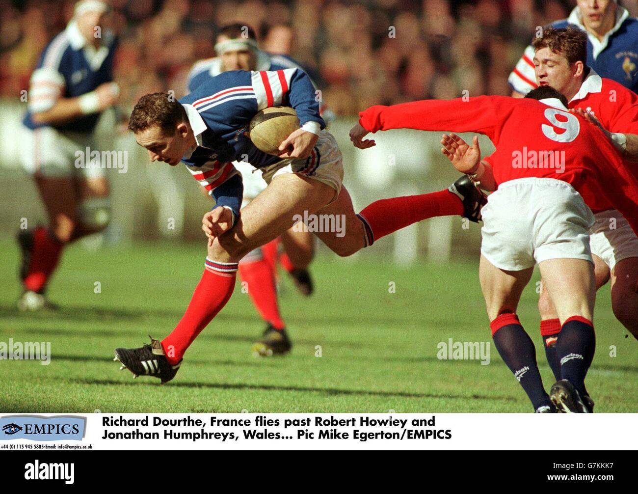 Richard Dourthe, France flies past Robert Howley and Jonathan Humphreys ...