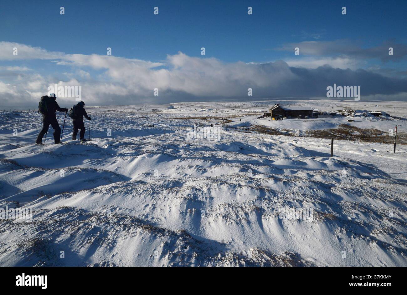 Steve Clough and Jill Armstrong make their way on their nordic skis to ...