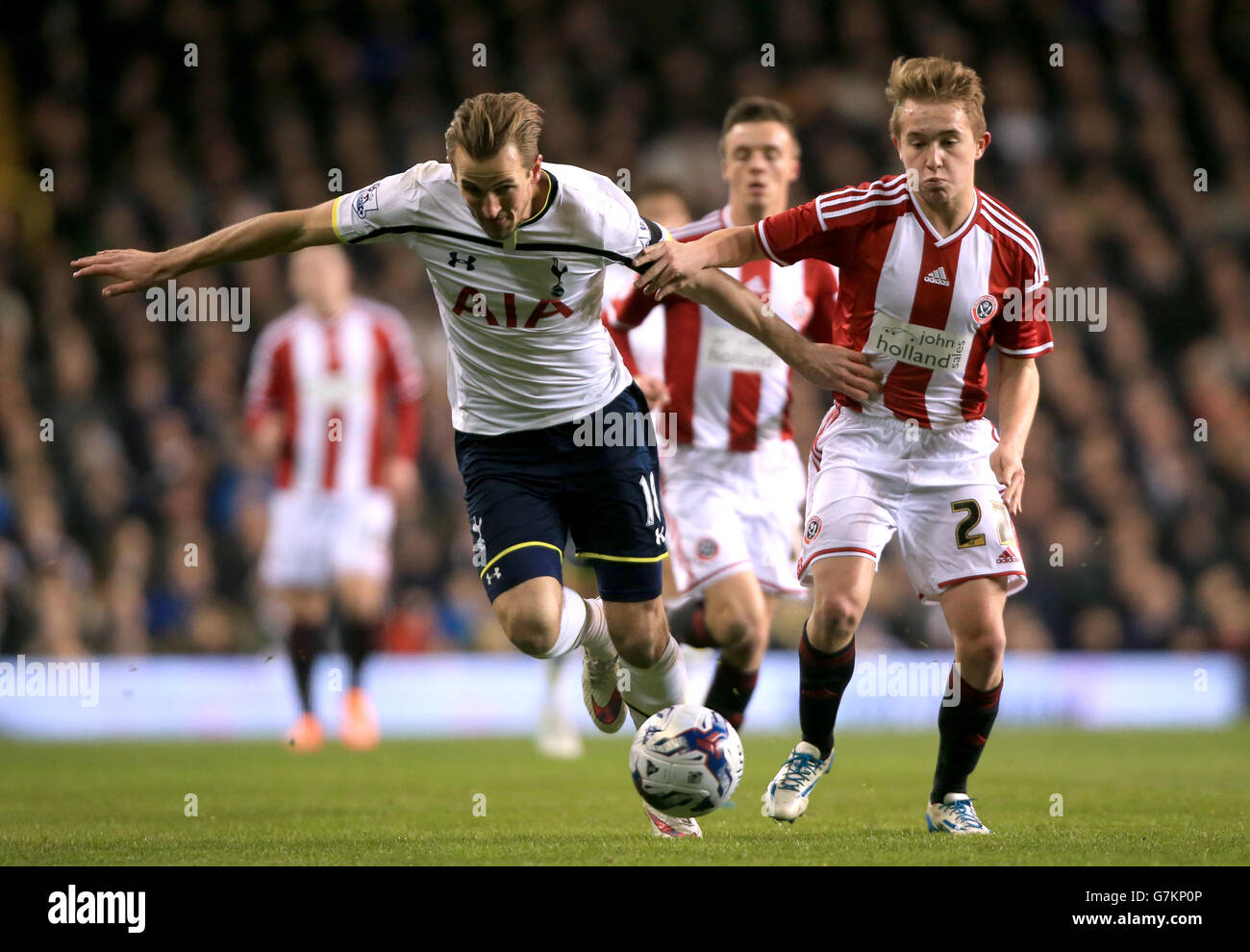 Tottenham Hotspur's Harry Kane (left) and Sheffield United's Louis Reed ...