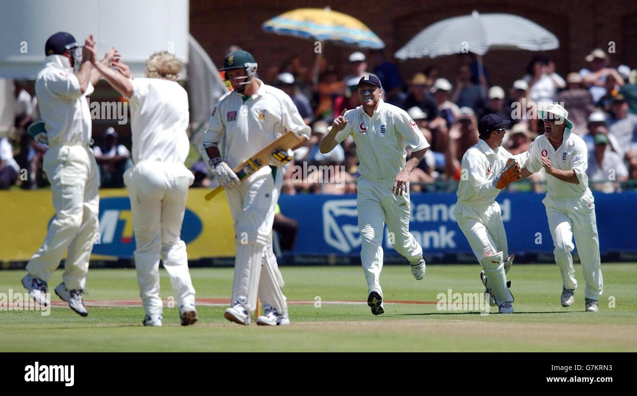 England celebrate after taking the wicket of South Africa's Graeme Smith (C). Smith was bowled ...