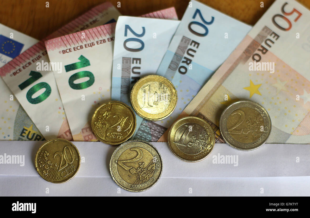 Stock picture of euro notes and coins Stock Photo - Alamy