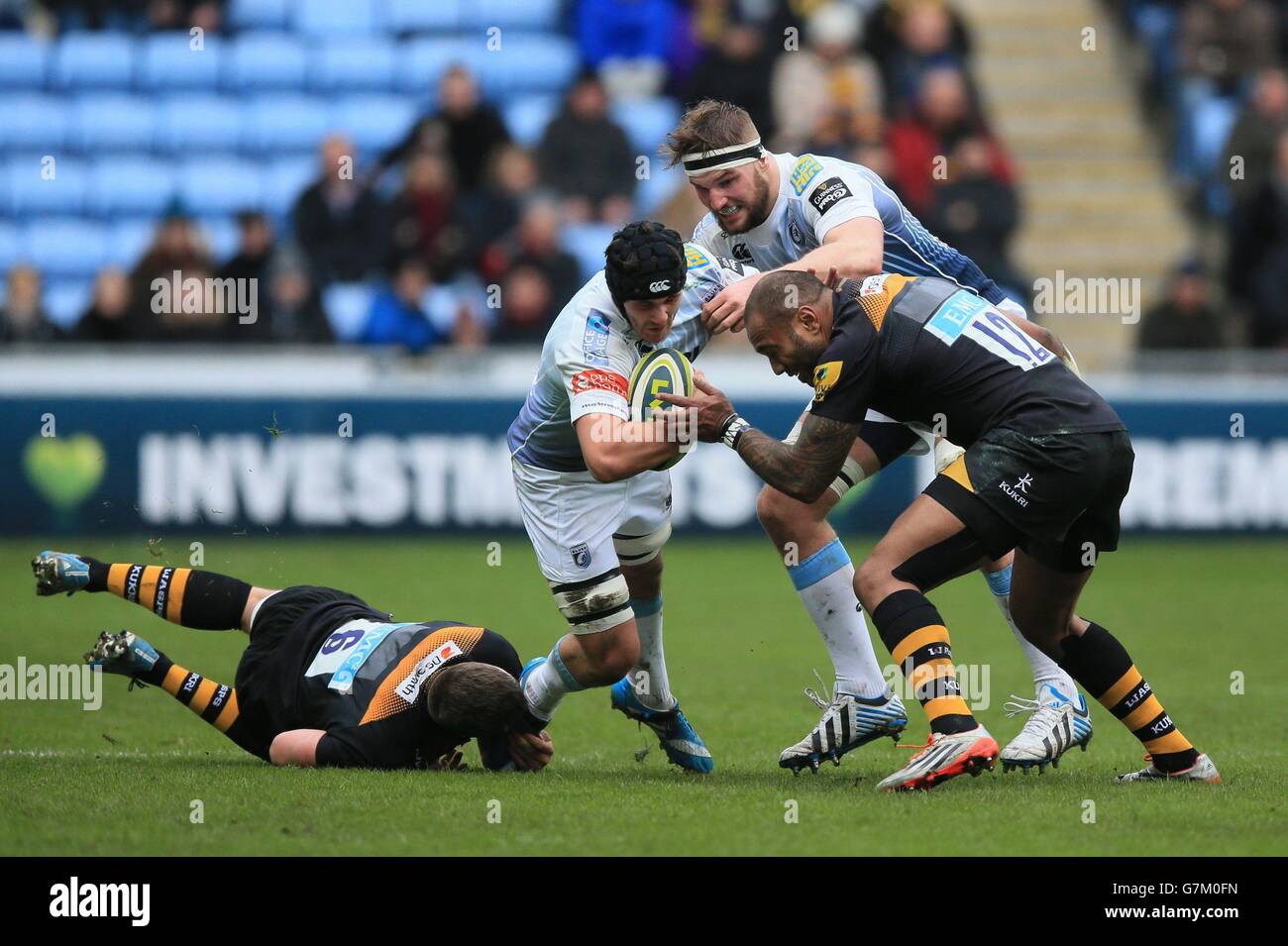 Wasps' Ed Jackson (left) and Sailosi Tagicakiau (right) tackle Cardiff ...