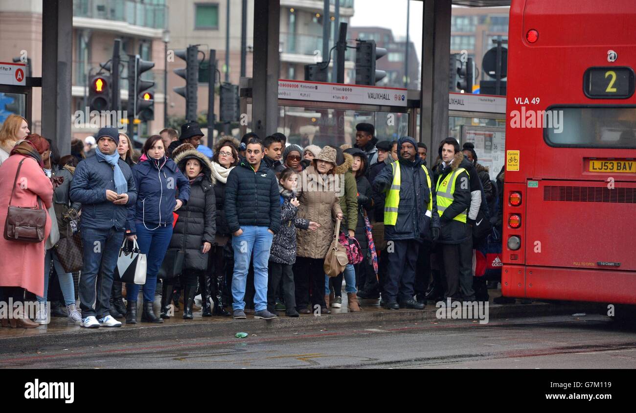 Commuters wait for buses outside Vauxhall bus station, London, as bus ...