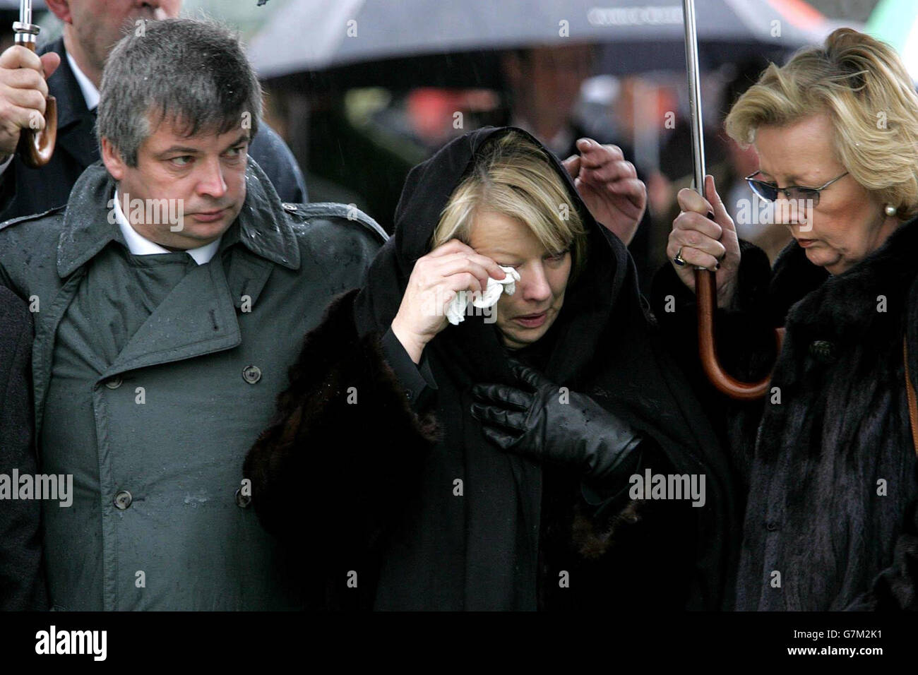 Champion Irish Showjumber Paul Darragh's wife Jane (centre) is consoled ...