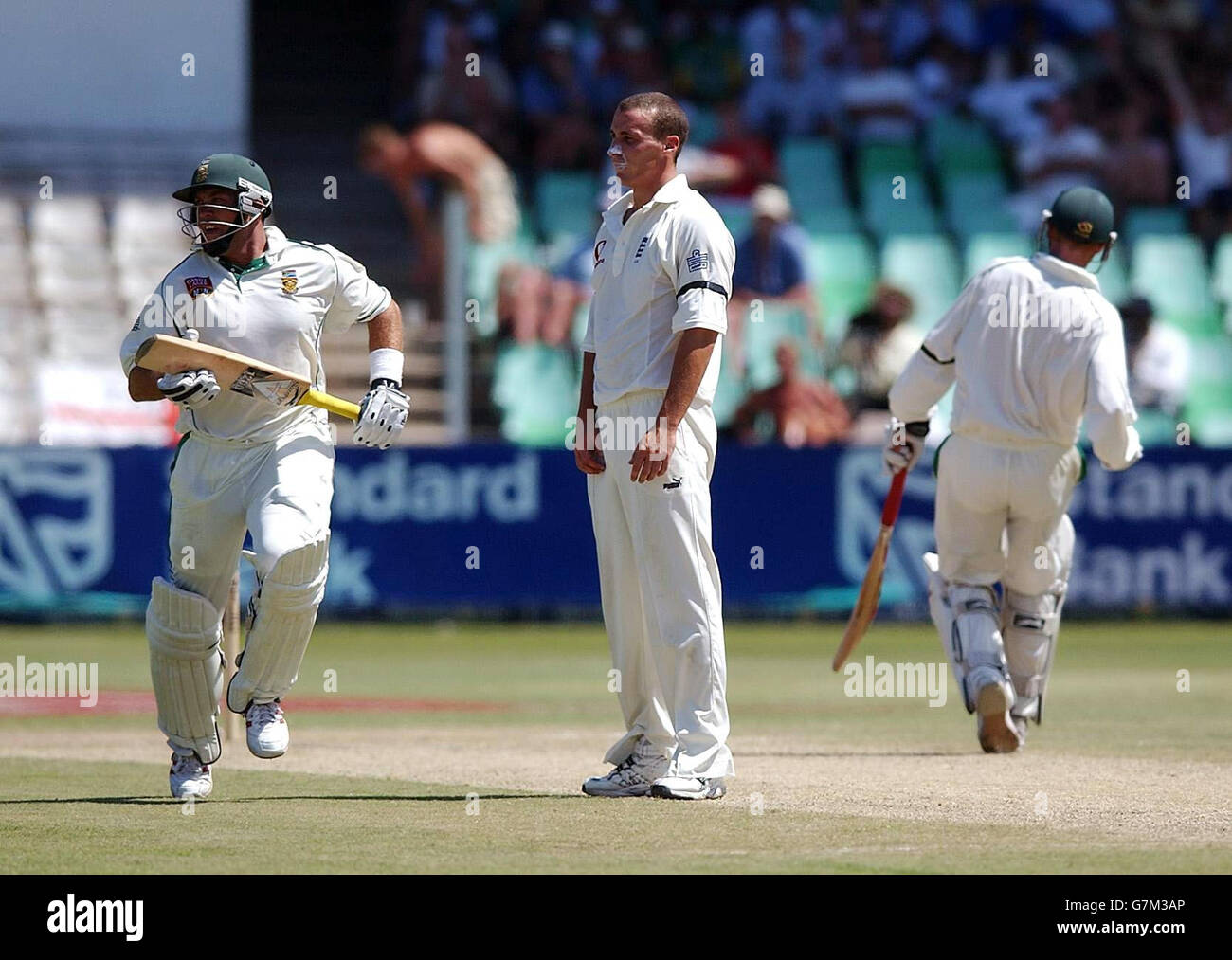 England bowler Simon Jones (centre) watches on as South Africa's ...