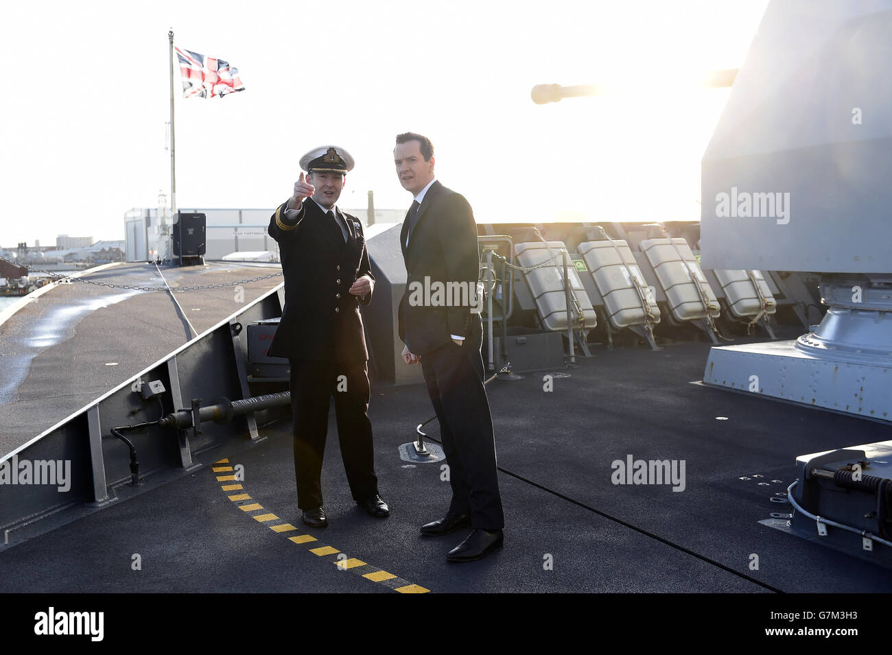 Chancellor George Osborne (right) is shown around HMS Defender by ...