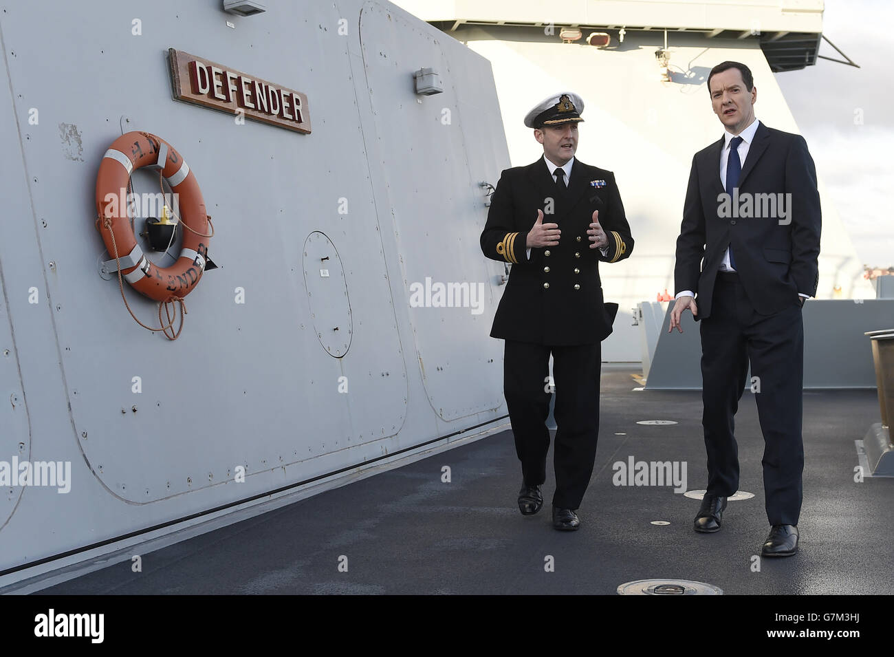 Chancellor George Osborne (right) is shown around HMS Defender by ...