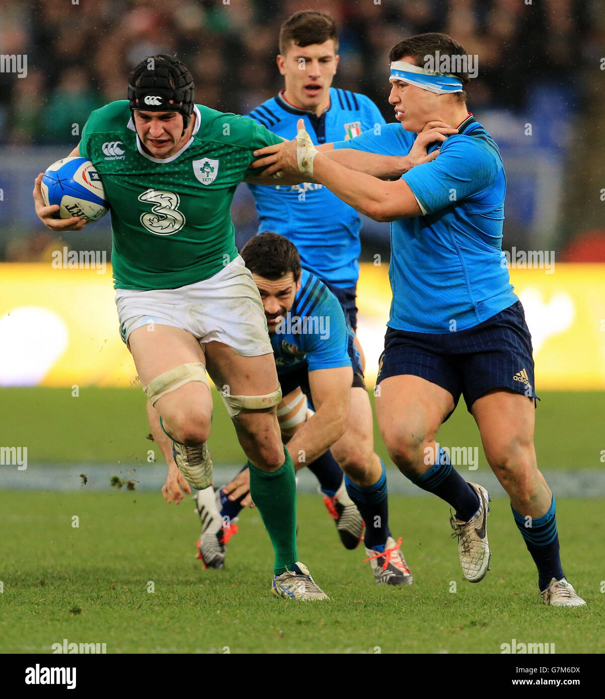 Ireland's Tommy O'Donnell (left) breaks through past Italy's Leonardo ...