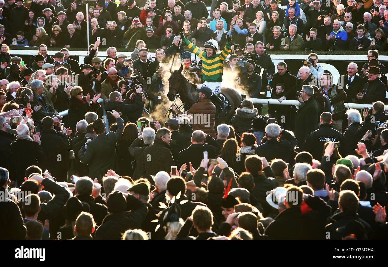 Jockey Tony McCoy enters the parade ring aboard Carlingford Lough after ...