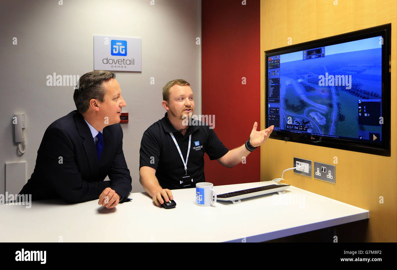 Prime Minister David Cameron (left) is shown simulator software by ...