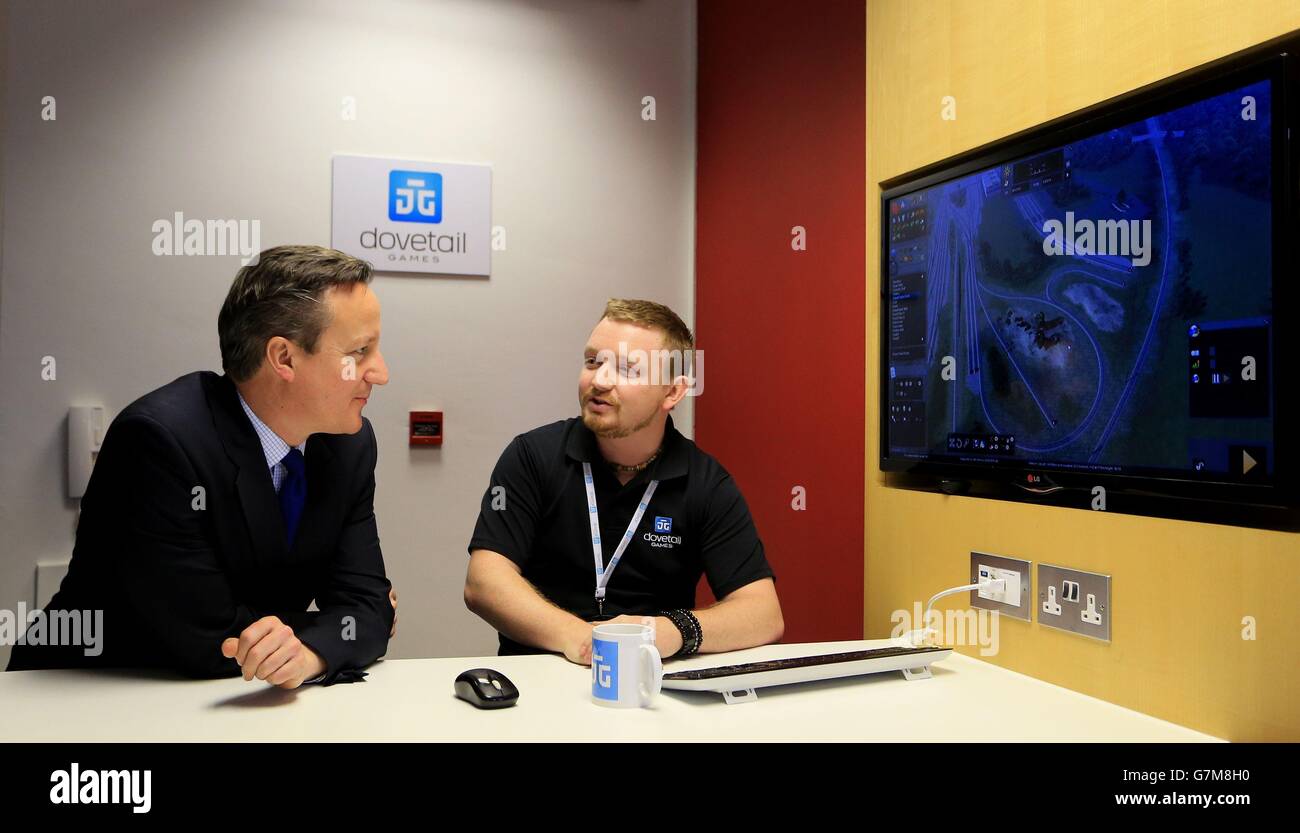 Prime Minister David Cameron (left) is shown simulator software by ...