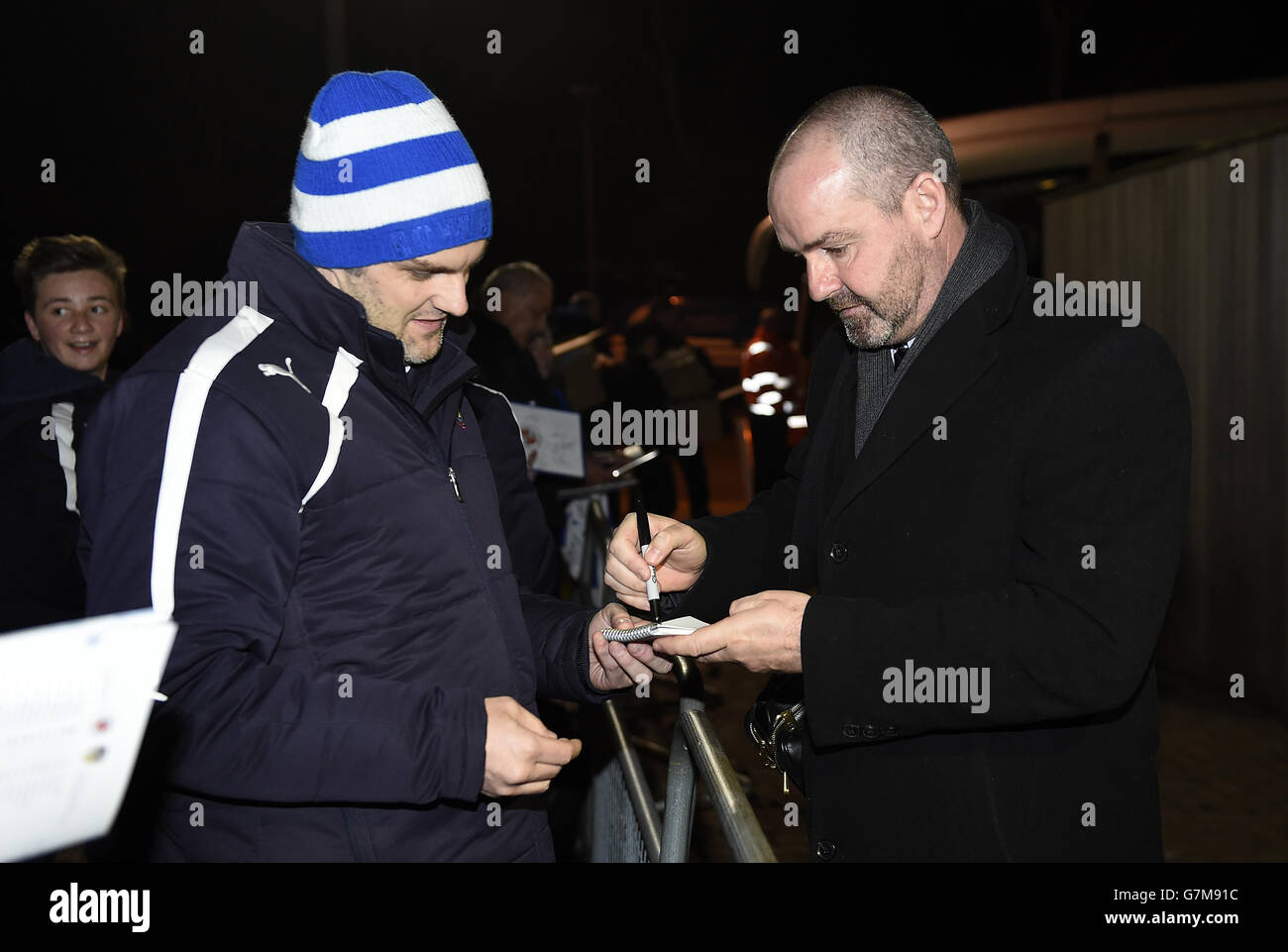 Reading manager Steve Clarke (right) signs autographs for fans before ...