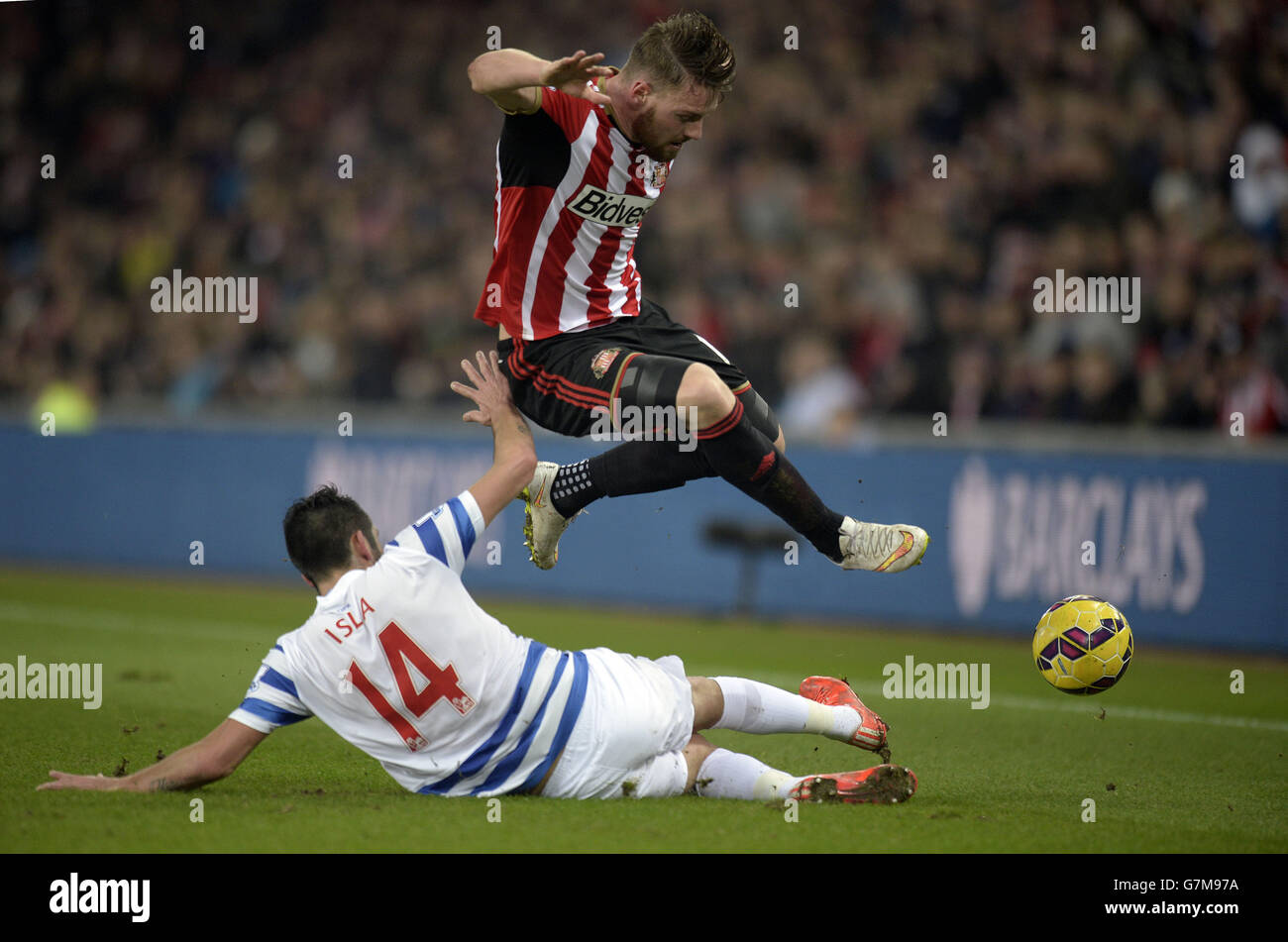 Sunderland's Connor Wickham and Queens Park Rangers' Mauricio Isla ...