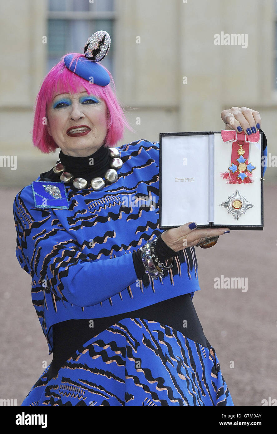 Fashion designer Zandra Rhodes holding her Dame Commander of the Order ...
