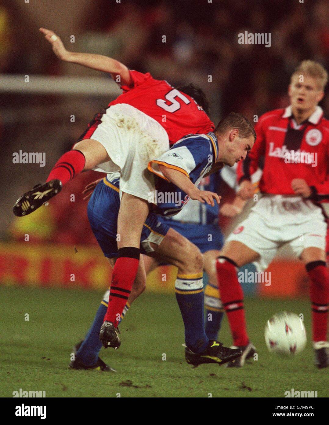 Steve Chettle, Nottingham Forest climbs over Andy Booth, Sheffield ...